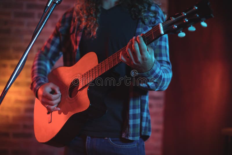 Mid Section of Singer Playing Guitar while Singing Stock Image - Image ...