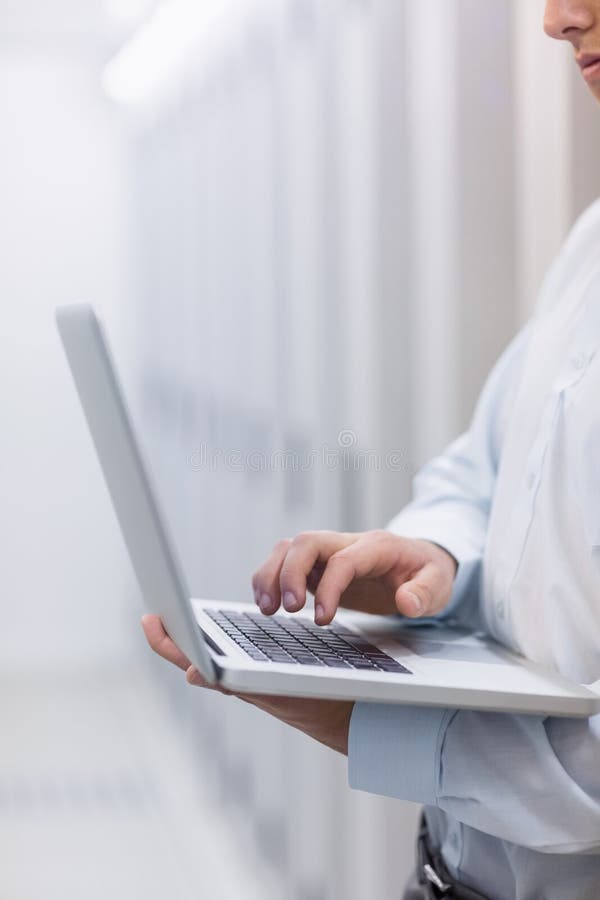 Mid Section of a Technician Typing on His Notebook Stock Image - Image ...