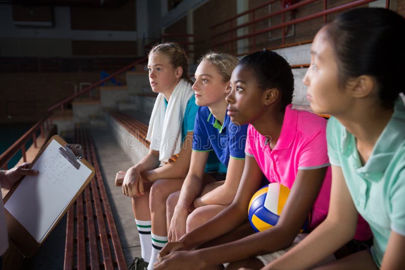 Volleyball Coach Talking To Female Players Stock Image - Image of adult ...