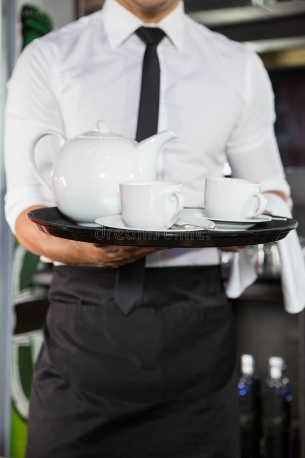 Mid Section of Waiter Serving Tea Stock Photo - Image of tray, luxury ...