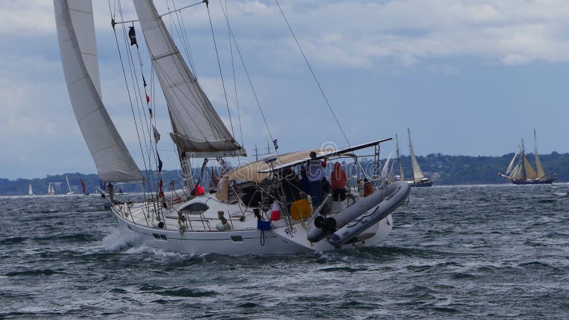 Sailboat Navigates Turbulent Seas Under Dark Stormy Skies Stock Photos ...