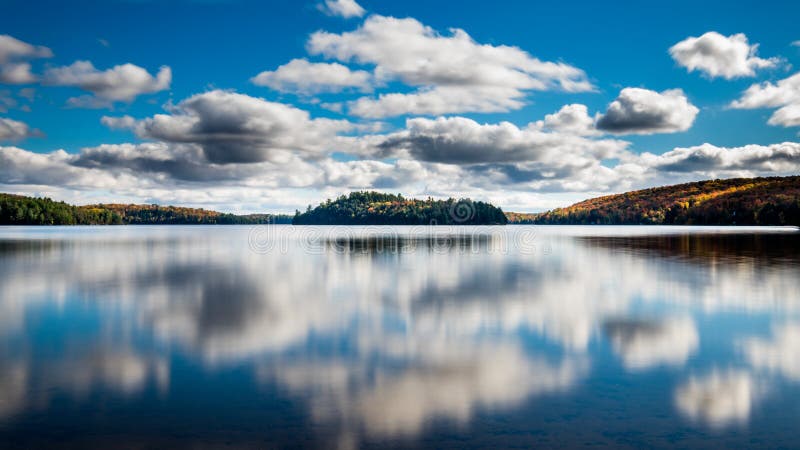 Midday Scene of a Lake with Blue Sky and Dramatic Clouds Stock Photo ...