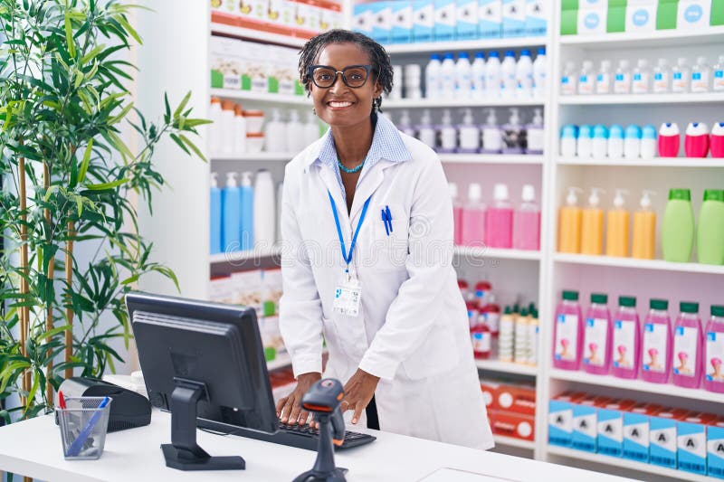 Middle Age African American Woman Pharmacist Smiling Confident Using ...