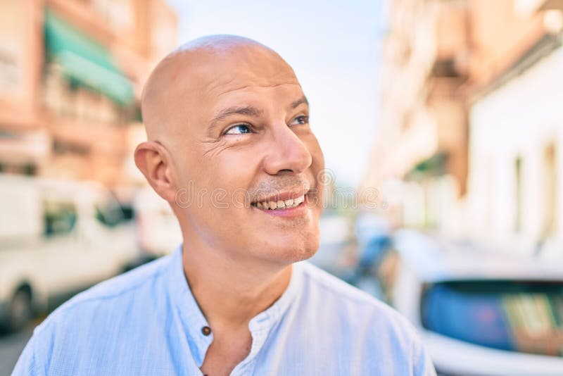Middle Age Bald Man Smiling Happy Walking at the City Stock Photo ...