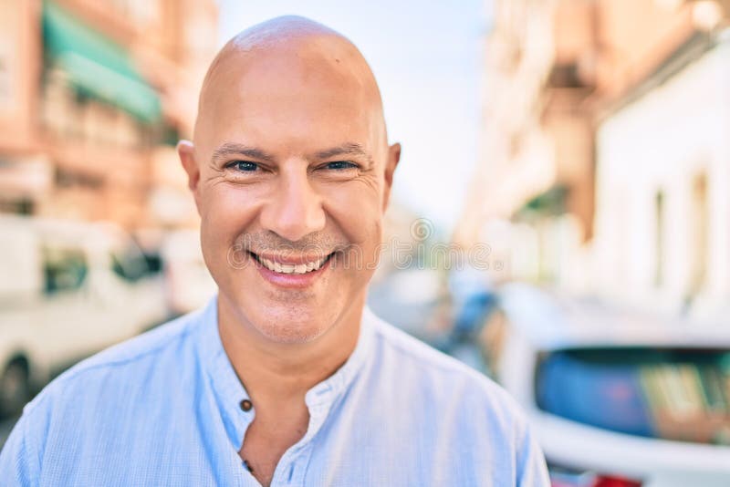Middle Age Bald Man Smiling Happy Walking at the City Stock Photo ...
