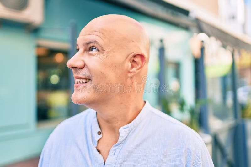 Middle Age Bald Man Smiling Happy Walking at the City Stock Photo ...