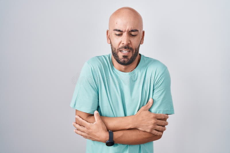 Middle Age Bald Man Standing Over White Background Shaking and Freezing ...