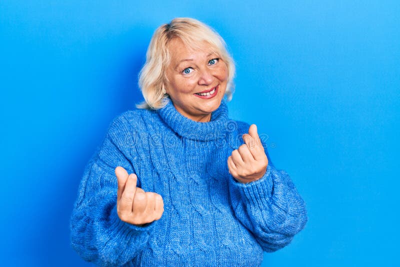 Middle Age Blonde Woman Wearing Casual Clothes Doing Money Gesture With