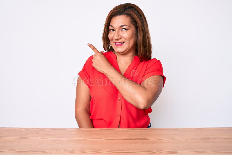 Middle Age Brunette Hispanic Woman Wearing Casual Clothes Sitting On