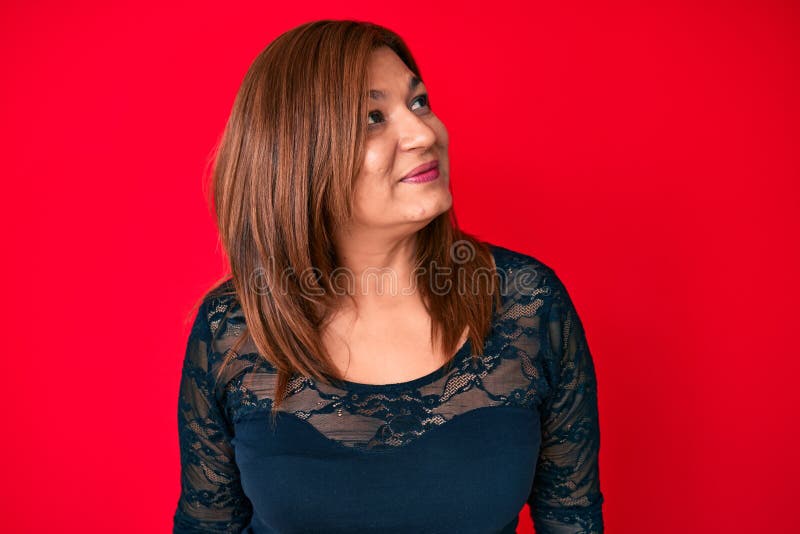 Middle Age Brunette Hispanic Woman Wearing Elegant Clothes Over Red