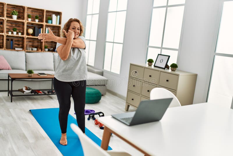 Middle Age Caucasian Woman Having Stretching Online Class at Home Stock ...