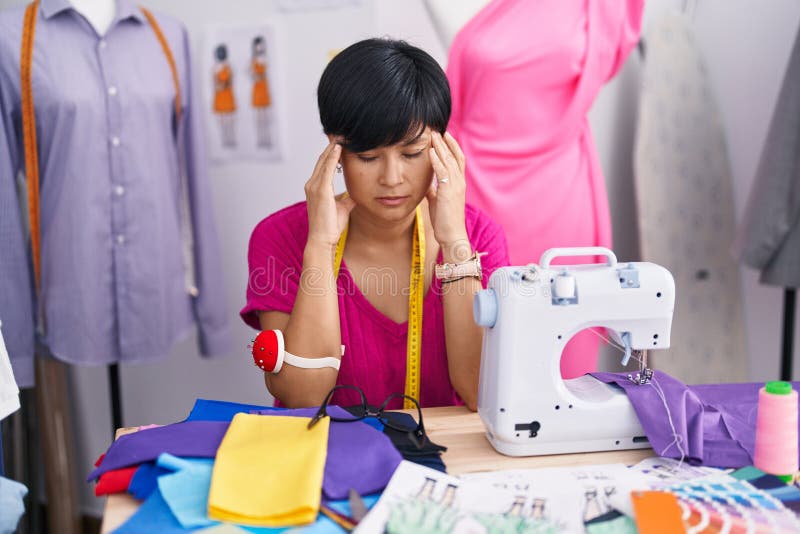 Middle Age Chinese Woman Tailor Stressed Using Sewing Machine at ...