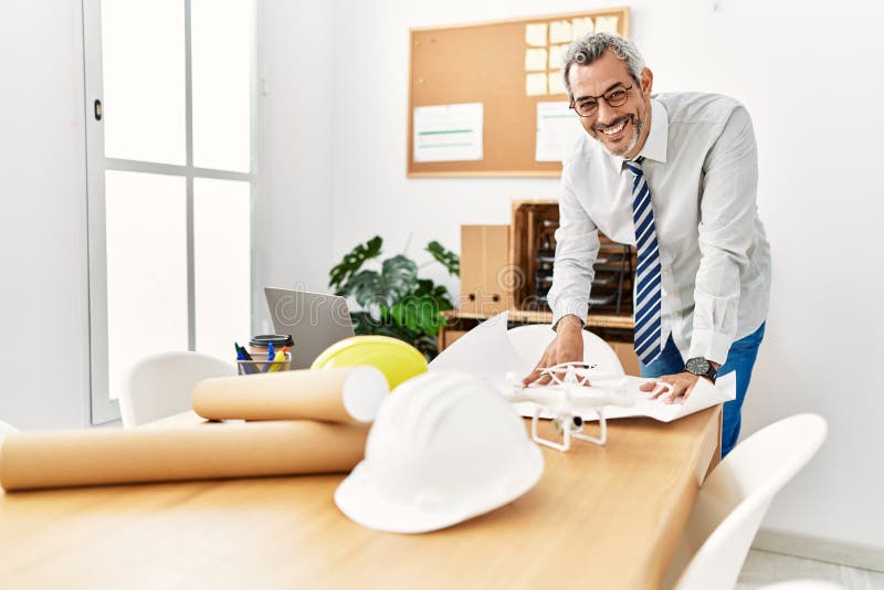 Middle Age Grey-haired Man Architect Looking House Plans at Office ...