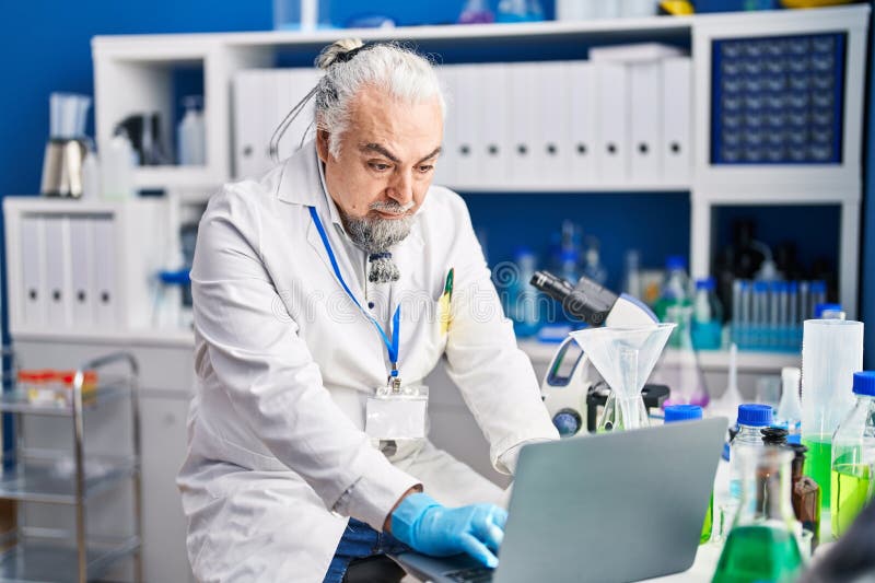 Middle Age Grey-haired Man Scientist Using Laptop at Laboratory Stock ...
