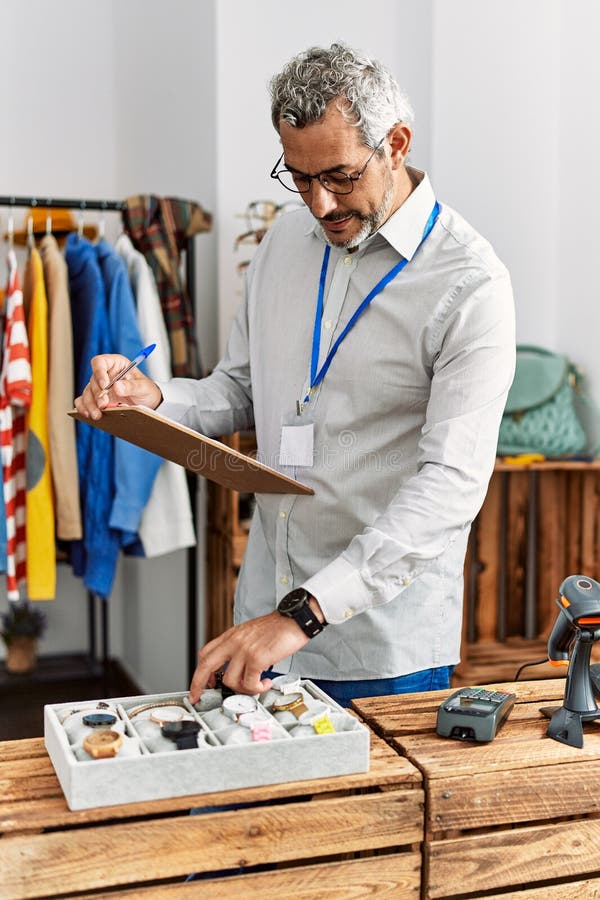 Middle Age Grey-haired Man Shop Assistant Writing on Document Looking ...