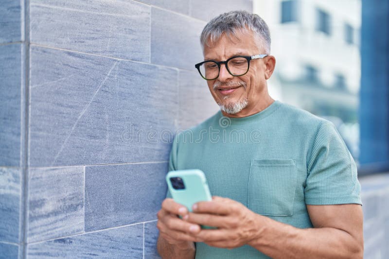 Middle Age Grey-haired Man Smiling Confident Using Smartphone at Street ...