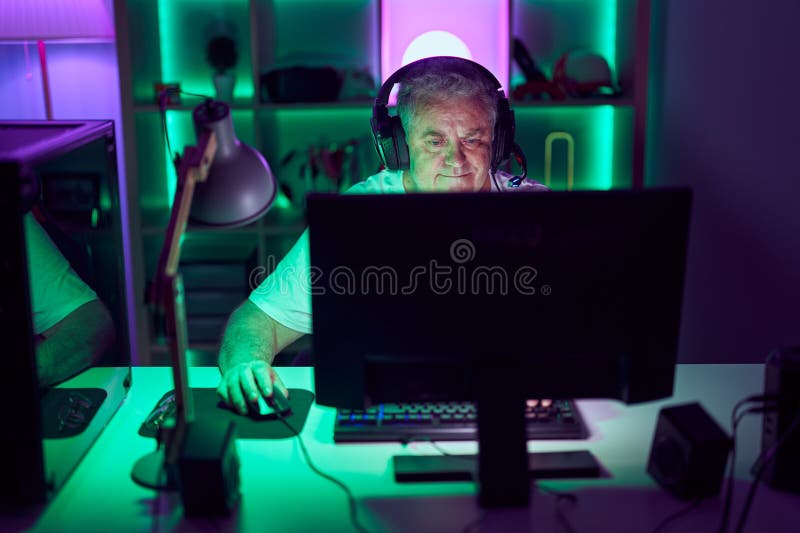 Middle Age Grey-haired Man Streamer Playing Video Game Using Computer ...