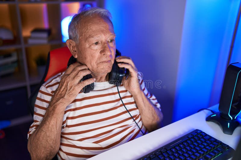 Middle Age Grey-haired Man Streamer Sitting on Table with Serious ...