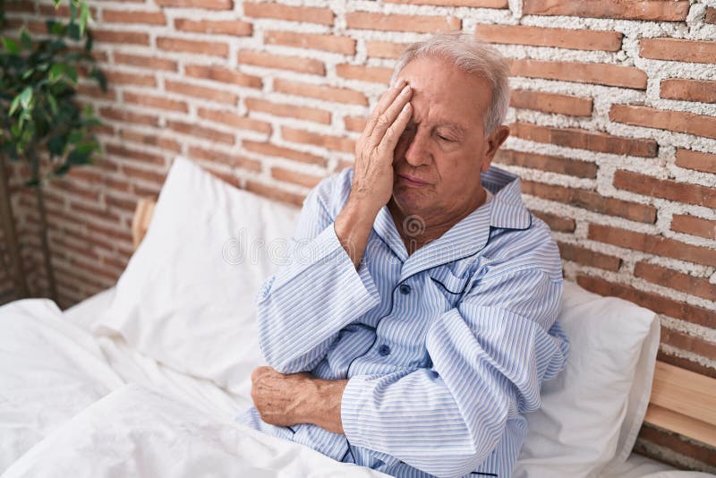 Middle Age Grey-haired Man Stressed Sitting on Bed at Bedroom Stock ...