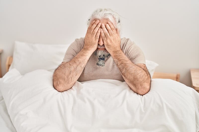 Middle Age Grey-haired Man Stressed Sitting on Bed at Bedroom Stock ...