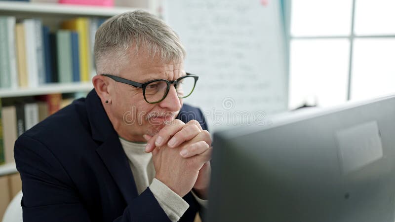 Middle Age Grey-haired Man Teacher Using Computer Studying at ...
