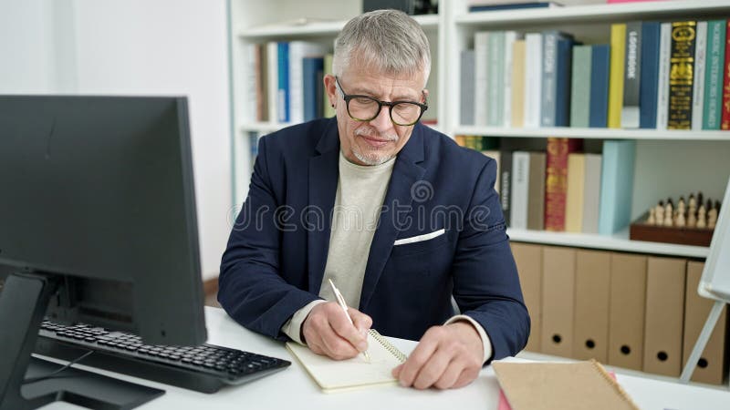 Middle Age Grey-haired Man Teacher Using Computer Writing on Notebook ...
