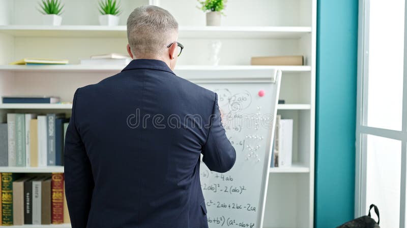 Middle Age Grey-haired Man Teacher Writing on White Board at University ...