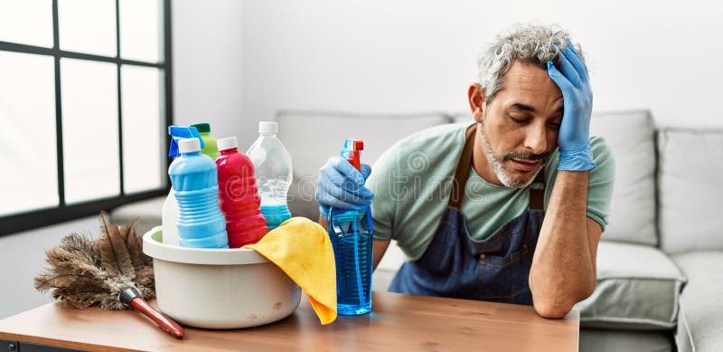 Middle Age Grey-haired Man Tired Cleaning Table at Home Stock Photo ...