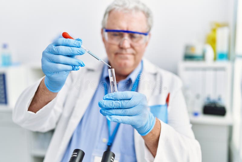 Middle Age Grey-haired Man Wearing Scientist Uniform Using Pipette at ...