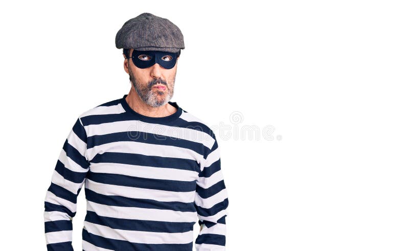 Middle Age Handsome Man Wearing Burglar Mask Making Fish Face with Lips ...