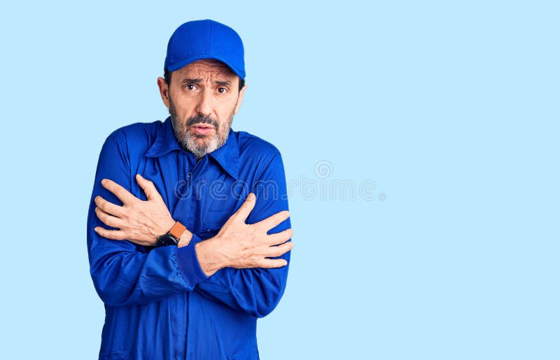 Middle Age Handsome Man Wearing Mechanic Uniform Shaking and Freezing ...
