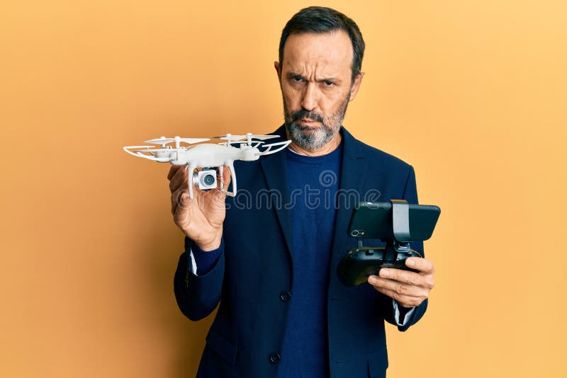 Middle Age Hispanic Man Using Drone Depressed and Worry for Distress ...