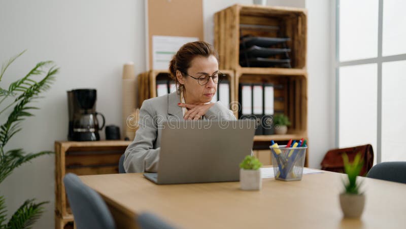Middle Age Hispanic Woman Business Worker Working at Office Stock Photo ...