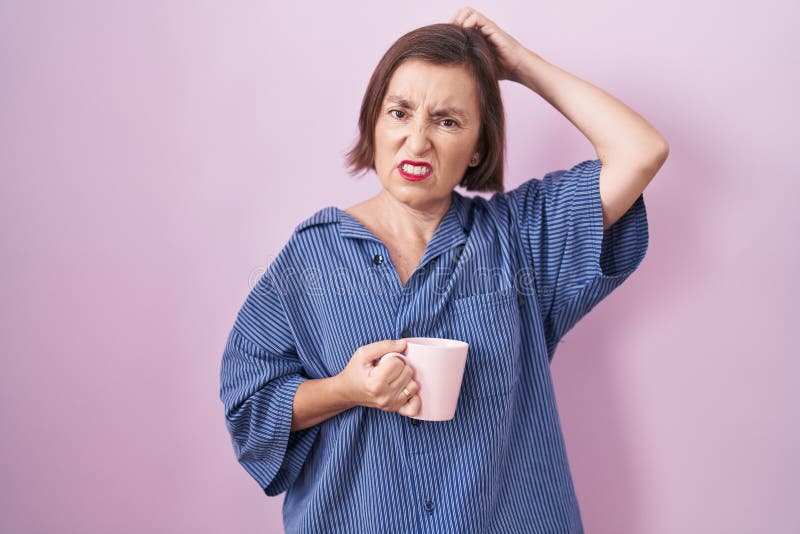 Middle Age Hispanic Woman Drinking a Cup Coffee Confuse and Wondering ...