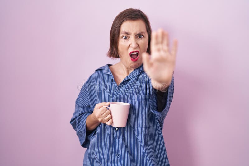 Middle Age Hispanic Woman Drinking a Cup Coffee Doing Stop Gesture with ...