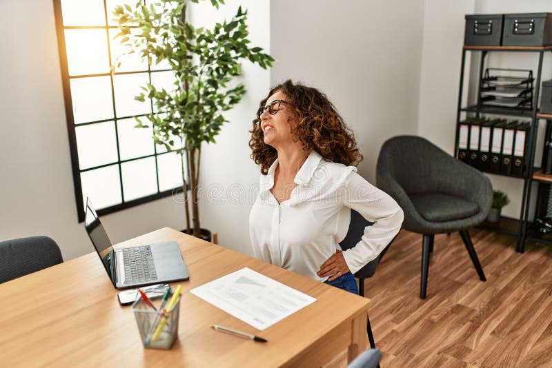 Middle Age Hispanic Woman Overworked with Back Pain at Office Stock ...
