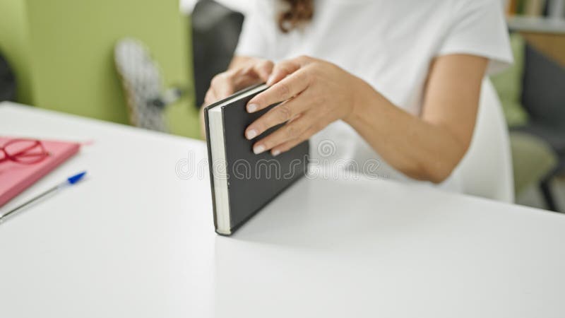 Middle Age Hispanic Woman Student Closing Book at Library University ...