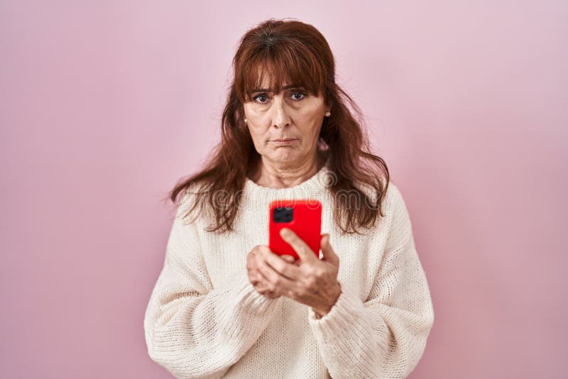 Middle Age Hispanic Woman Using Smartphone Typing Message Depressed and ...