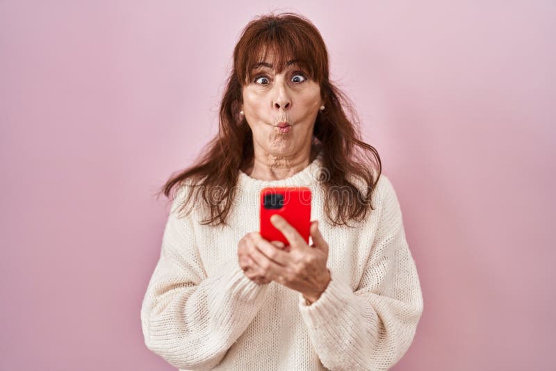 Middle Age Hispanic Woman Using Smartphone Typing Message Making Fish ...