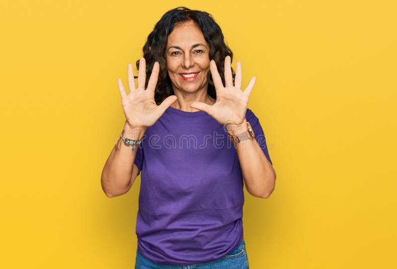 Middle Age Hispanic Woman Wearing Casual Clothes Showing And Pointing