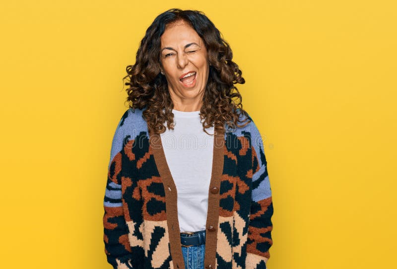Middle Age Hispanic Woman Wearing Casual Clothes Winking Looking At The