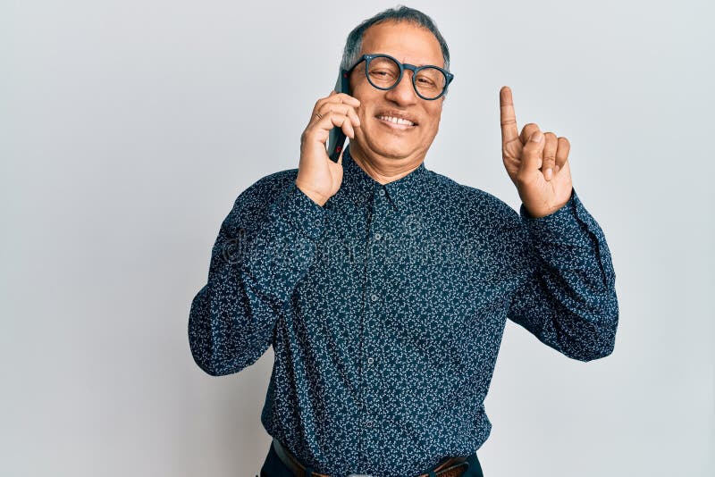 Middle Age Indian Man Having Conversation Talking on the Smartphone ...