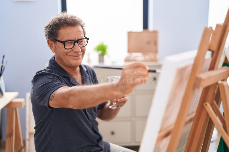 Middle Age Man Artist Drinking Wine Drawing at Art Studio Stock Photo ...