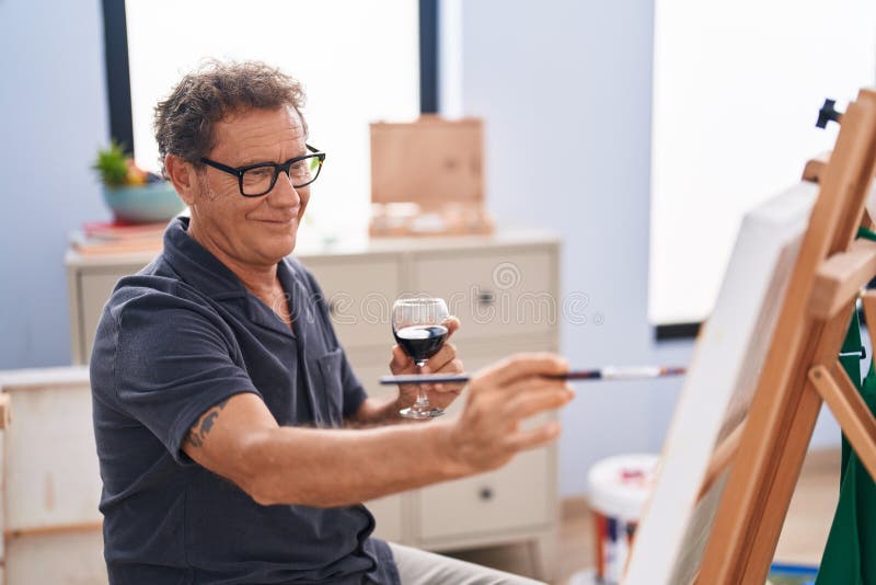Middle Age Man Artist Drinking Wine Drawing at Art Studio Stock Photo ...