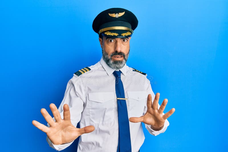 Middle Age Man with Beard and Grey Hair Wearing Airplane Pilot Uniform ...