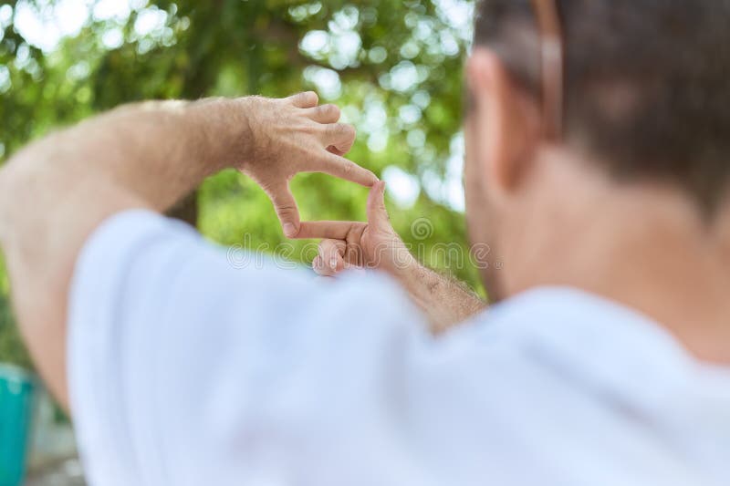 Middle Age Man Doing Photo Gesture with Hands at Park Stock Photo ...
