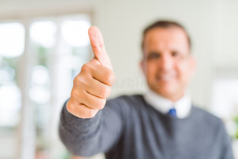 Middle Age Man Doing Postive Gesture with Thumbs Up Smiling To the ...