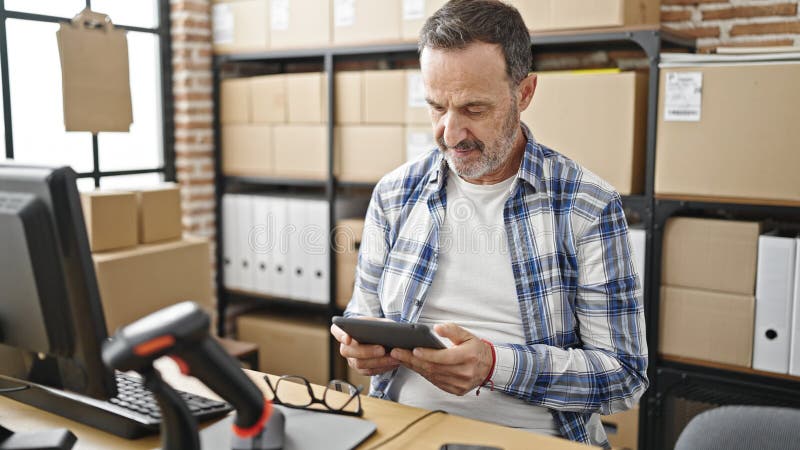 Middle Age Man Ecommerce Business Worker Using Touchpad Working at ...