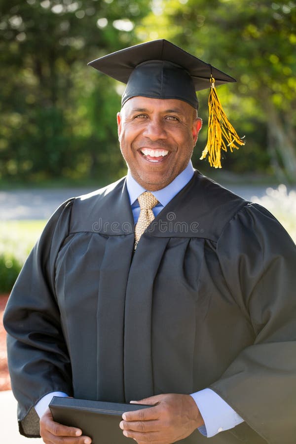 Middle age man graduating stock photo. Image of colors - 103573680