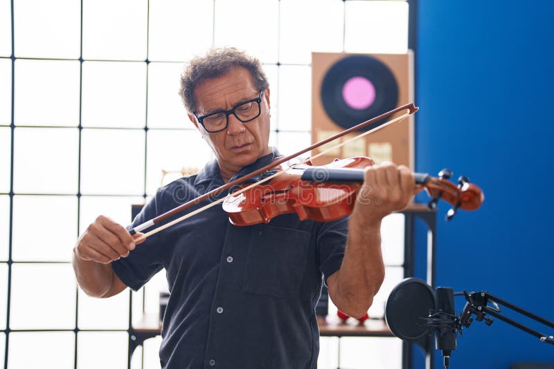 Middle Age Man Musician Playing Violin at Music Studio Stock Image ...